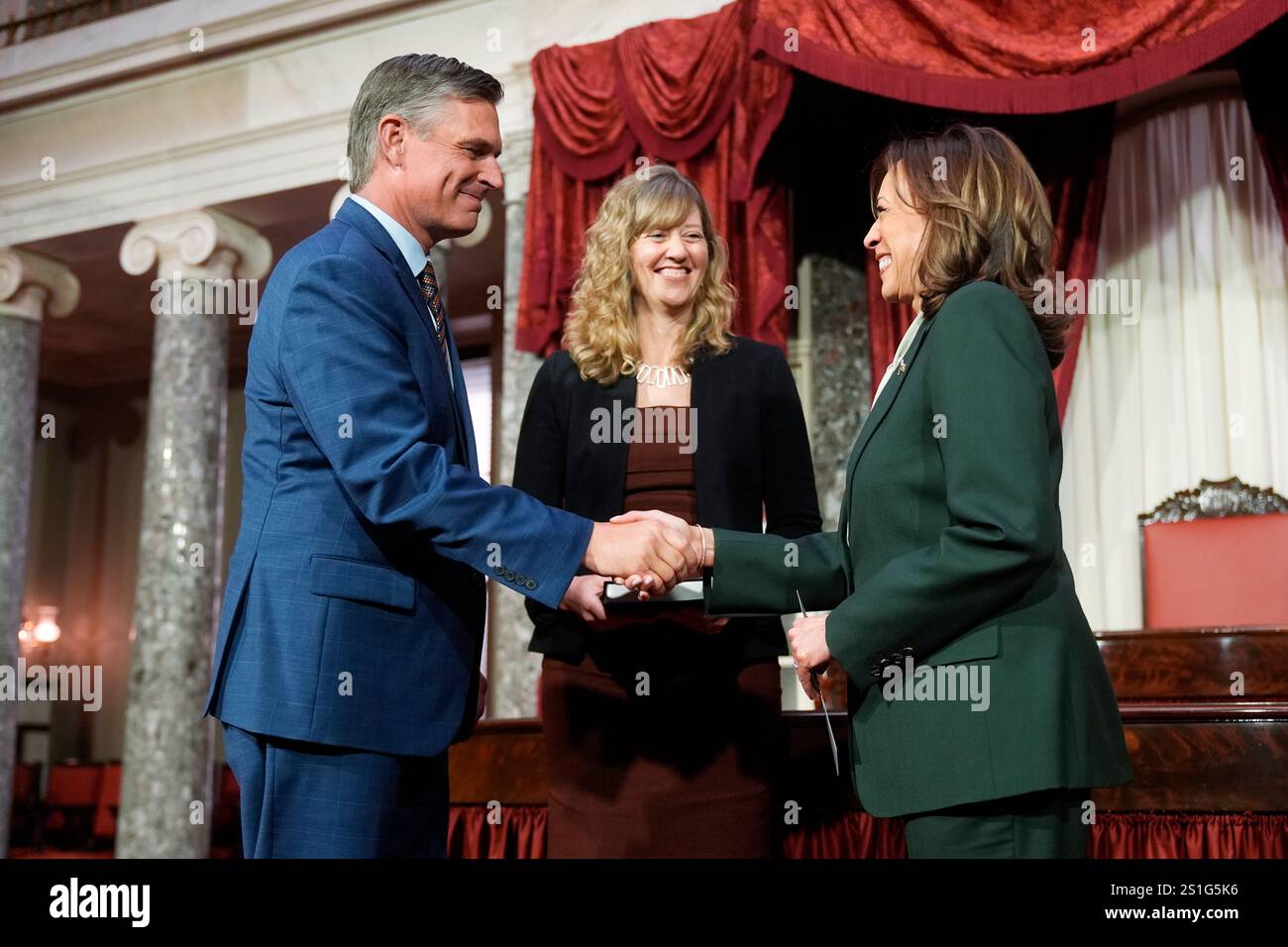 Sen. Martin Heinrich, D-N.M., left, shakes hands with Vice President ...
