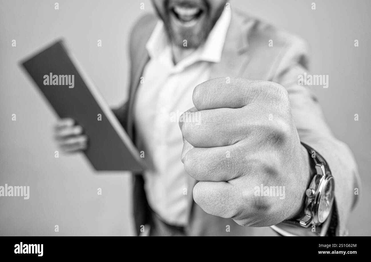 Angry and aggressive man threatening with fist. Angry businessman ...