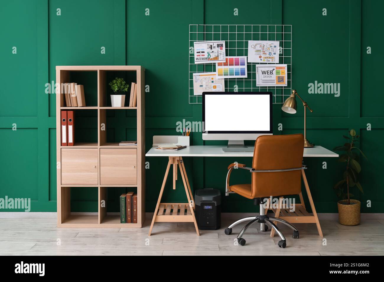 Interior of office with workplace, pin board and shelf unit Stock Photo ...