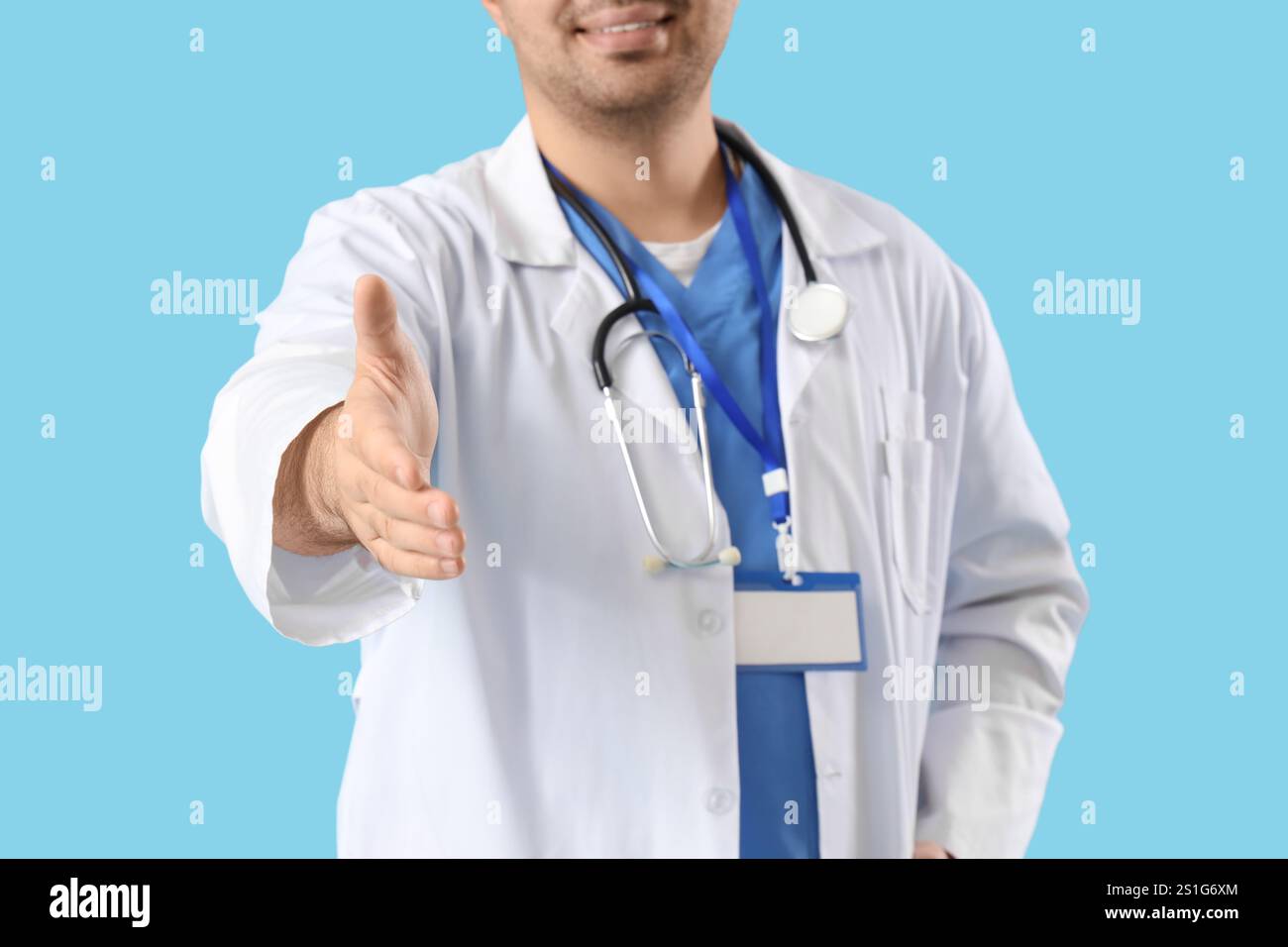 Doctor giving medical handshake in hi-res stock photography and images ...