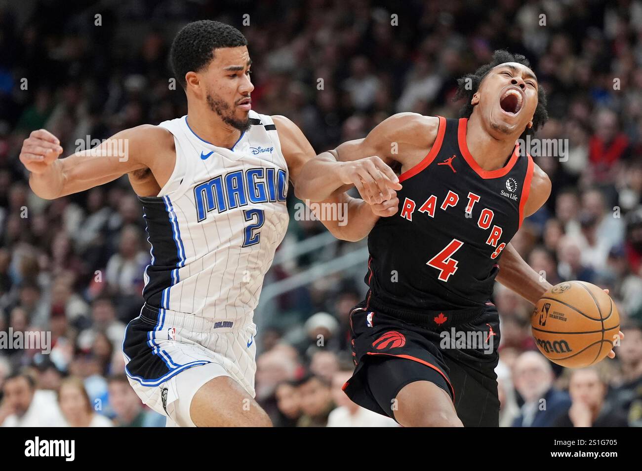 Toronto Raptors forward Scottie Barnes (4) is fouled by Orlando Magic ...