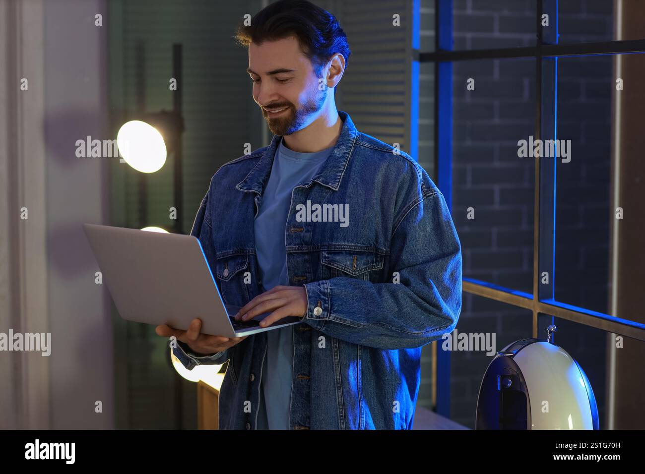 Male programmer having coffee break in office at night Stock Photo - Alamy