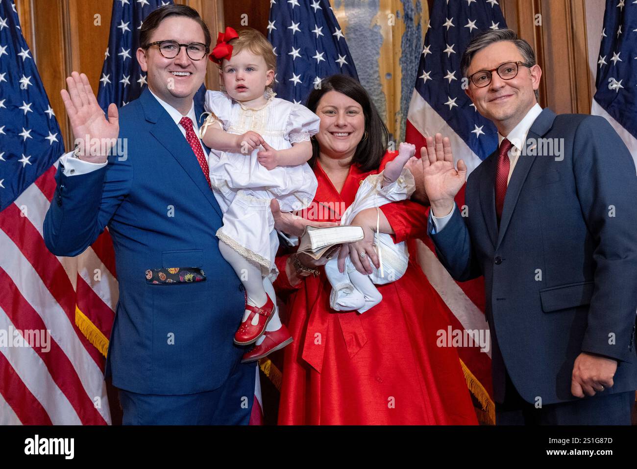 House Speaker Mike Johnson, R-La., right, poses during a ceremonial swearing-in with Rep ...