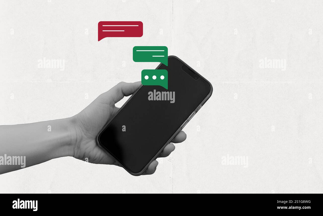 Hand holding phone with pop up chat bubble, online conversation concept ...