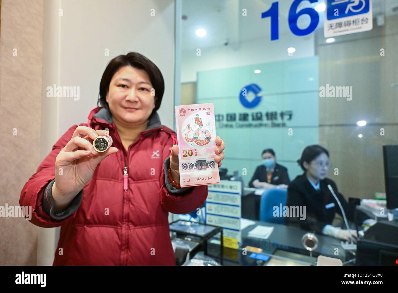 Beijing, China. 3rd Jan, 2025. A citizen shows newly exchanged ...