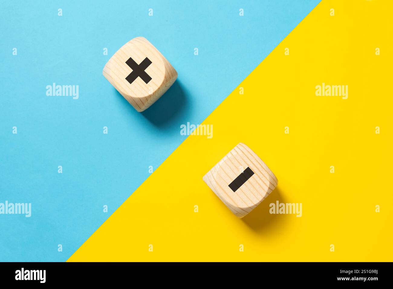 Concept of contrast, opposites, pros and cons with wood block plus and ...