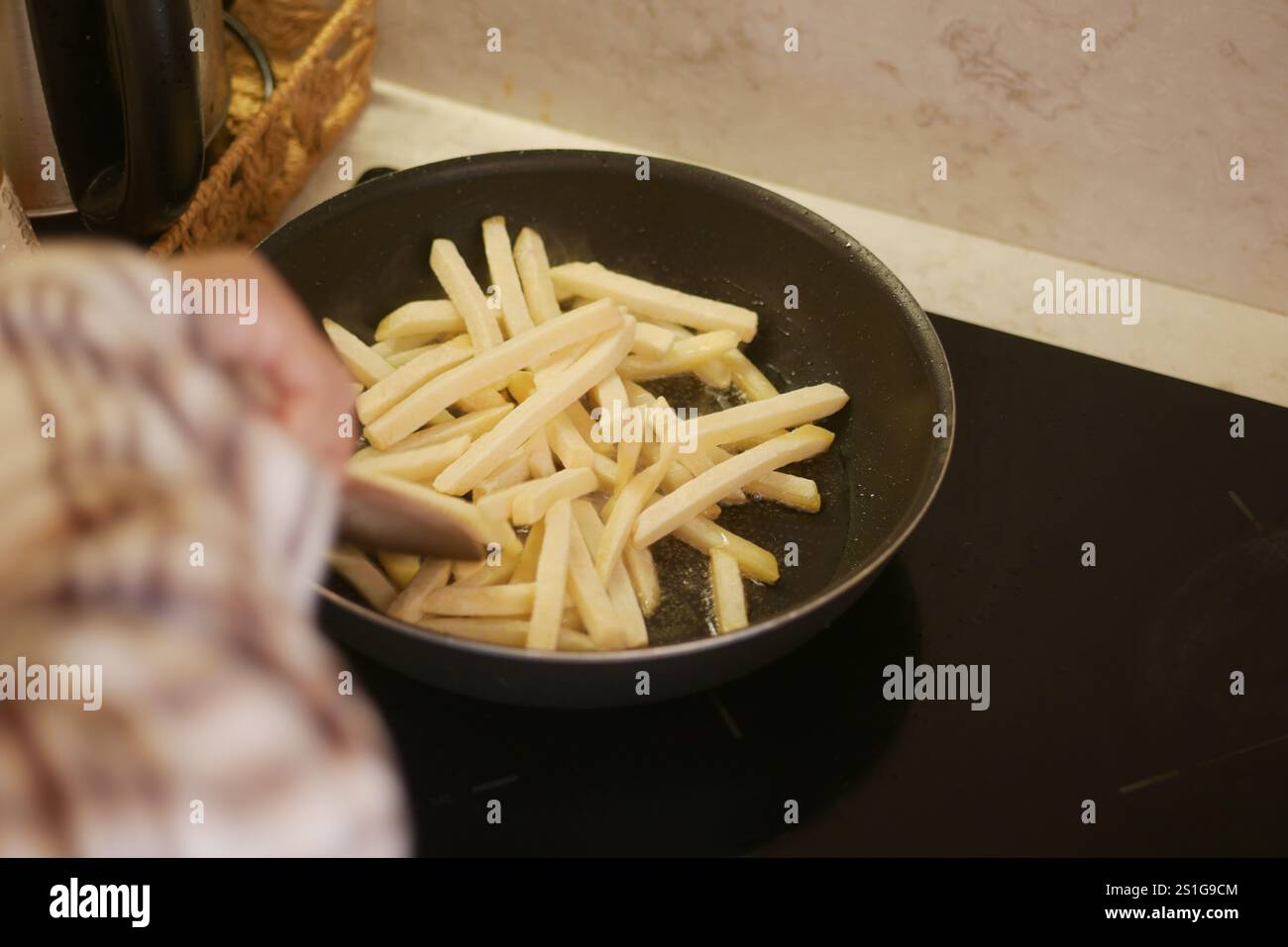 Cooking Delicious French Fries in a Pan on the Stove for a Tasty Meal ...