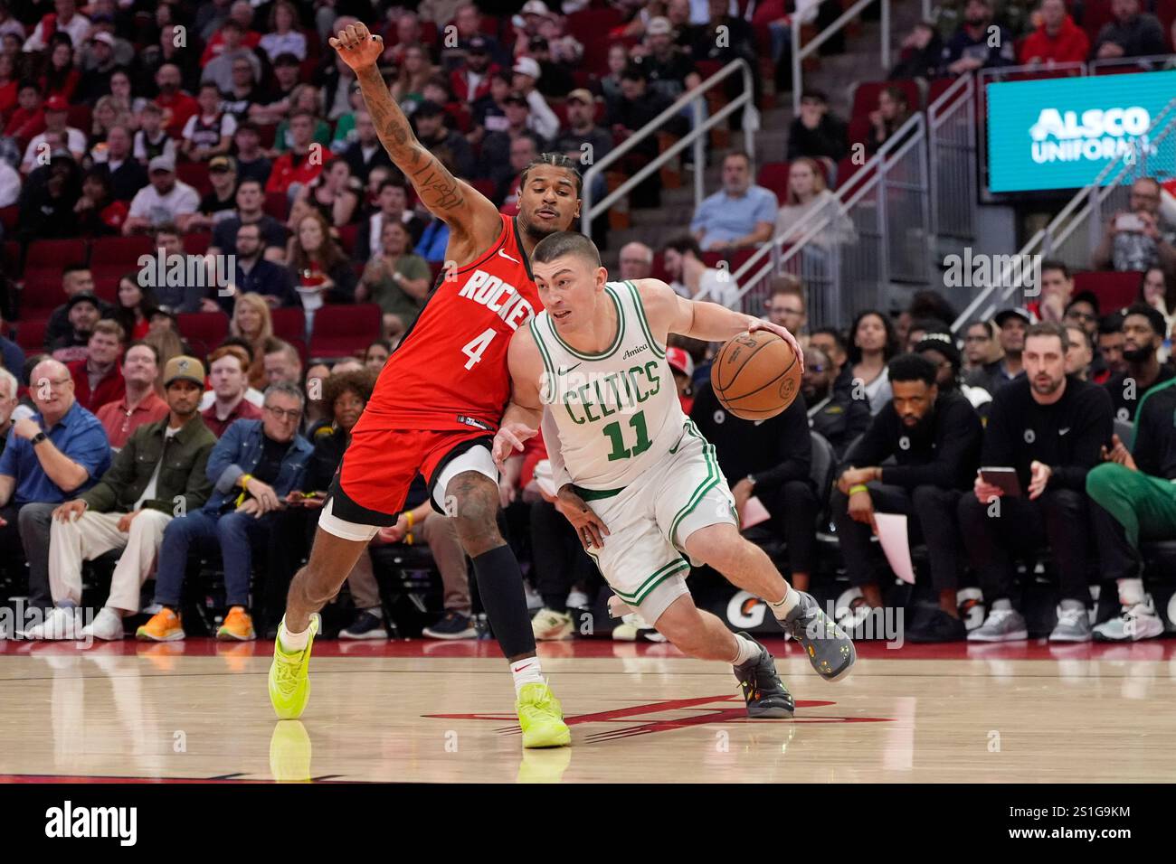 Boston Celtics' Payton Pritchard (11) drives around Houston Rockets ...