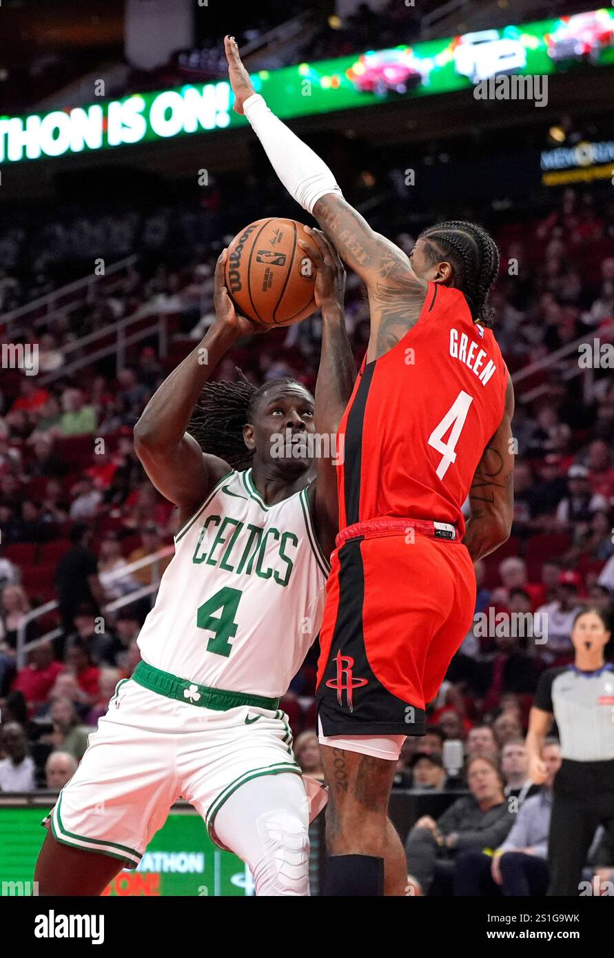 Boston Celtics' Jrue Holiday, left, shoots as Houston Rockets' Jalen ...