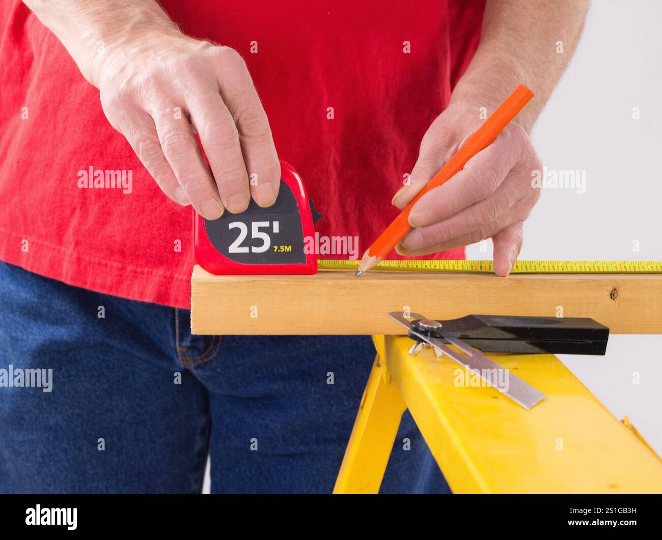 Tools for construction job site measure tape for cut Stock Photo - Alamy
