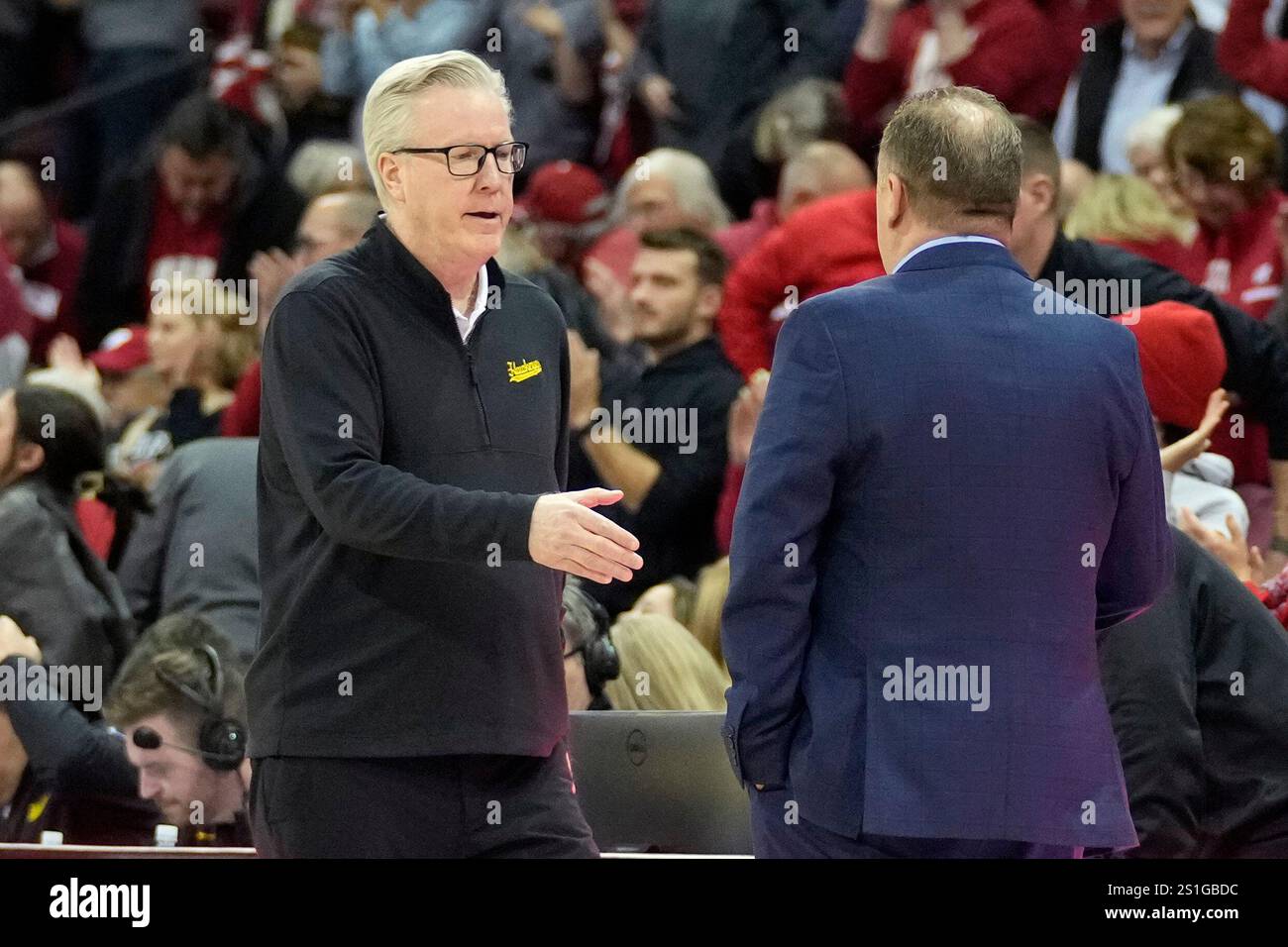 Iowa head coach Fran McCaffery, left, and Wisconsin head coach Greg ...