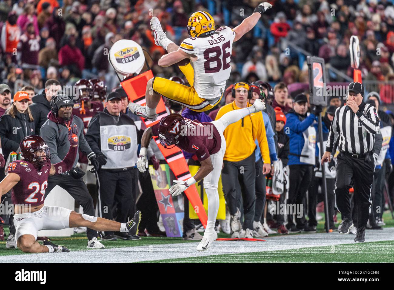 Minnesota tight end Jameson Geers (86) goes over Virginia Tech ...