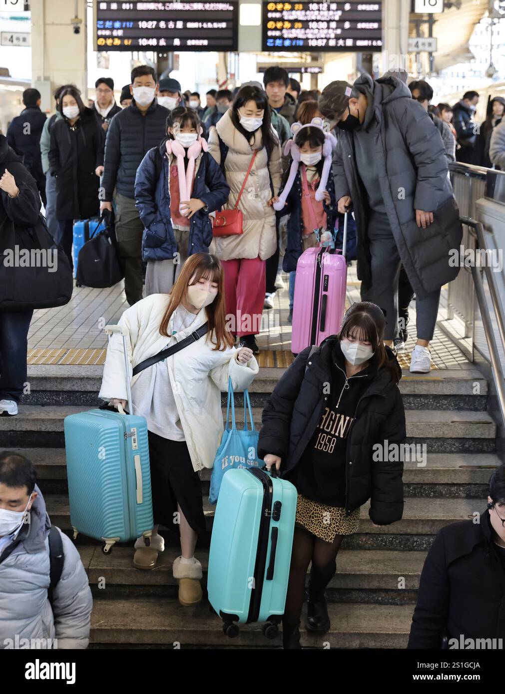 A platform of Shinkansen bullet train is crowded with passengers at JR ...