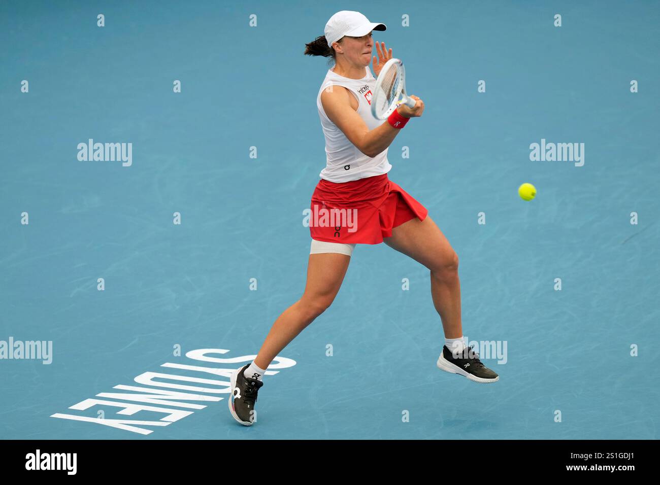 Poland's Iga Swiatek plays a forehand to Kazakhstan's Elena Rybakina ...