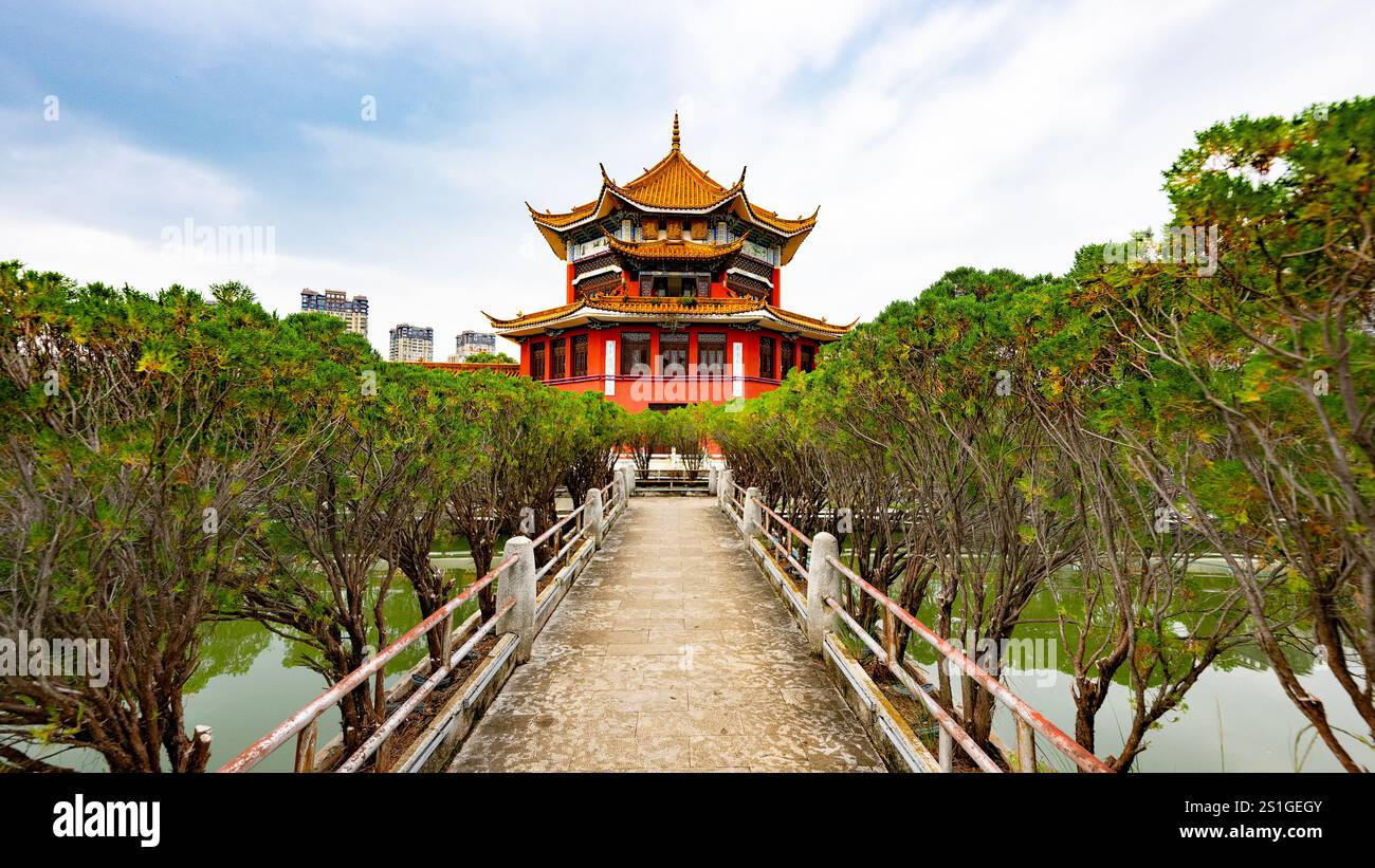 Buddhist temple with a bridge over the lake in Yunnan Province Stock ...