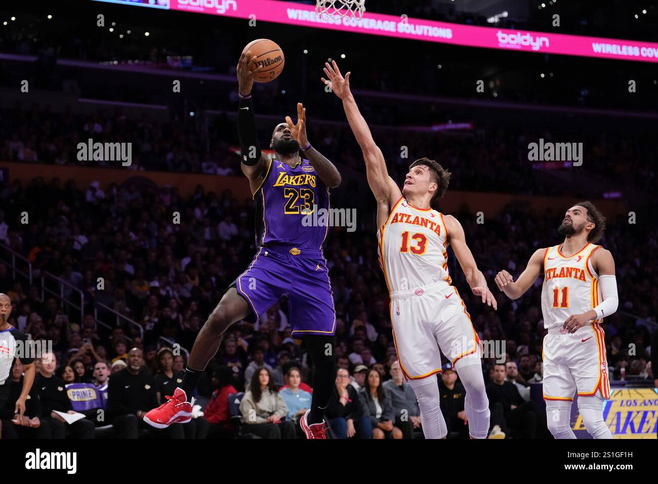 Los Angeles Lakers forward LeBron James, left, shoots as Atlanta Hawks ...
