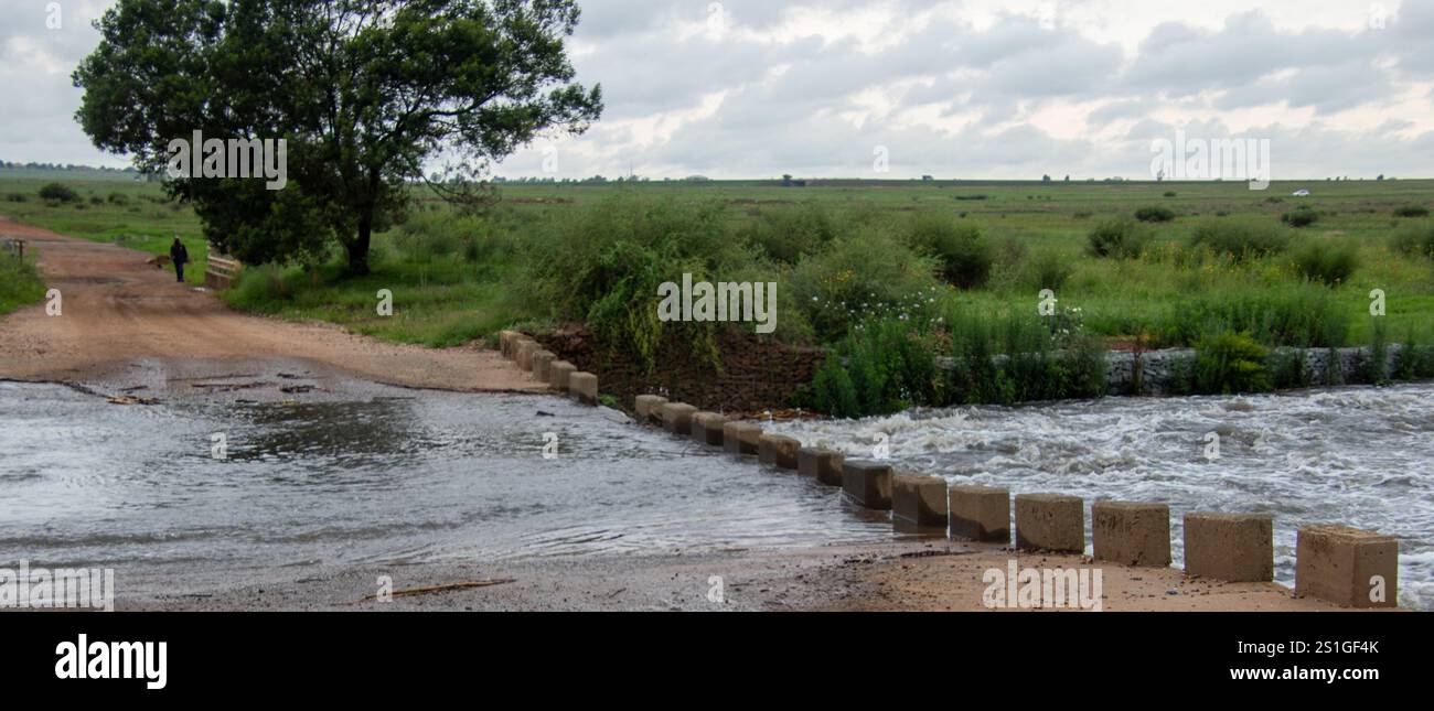 Johannesburg, South Africa - unidentified pedestrian walking on a dirt ...