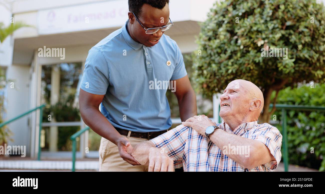 Nurse, help and shoulder pain with old man outdoor for rehabilitation ...