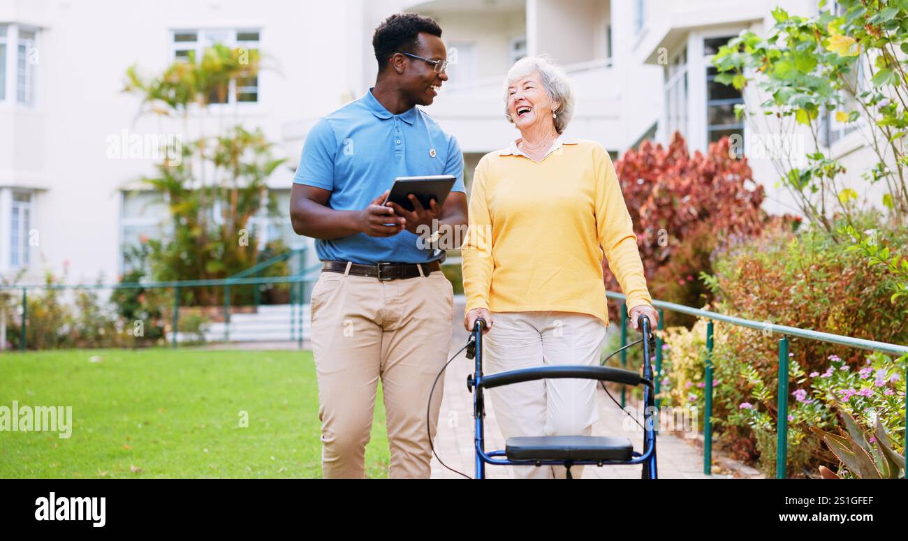 Caregiver, happy and tablet with old woman and walker for ...