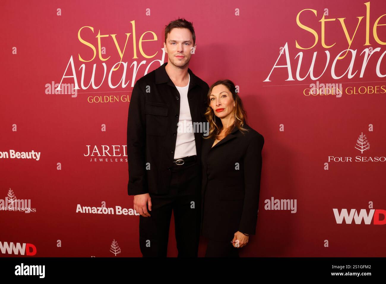 British actor Nicholas Hoult (L) and guest attend the WWD Style Awards ...