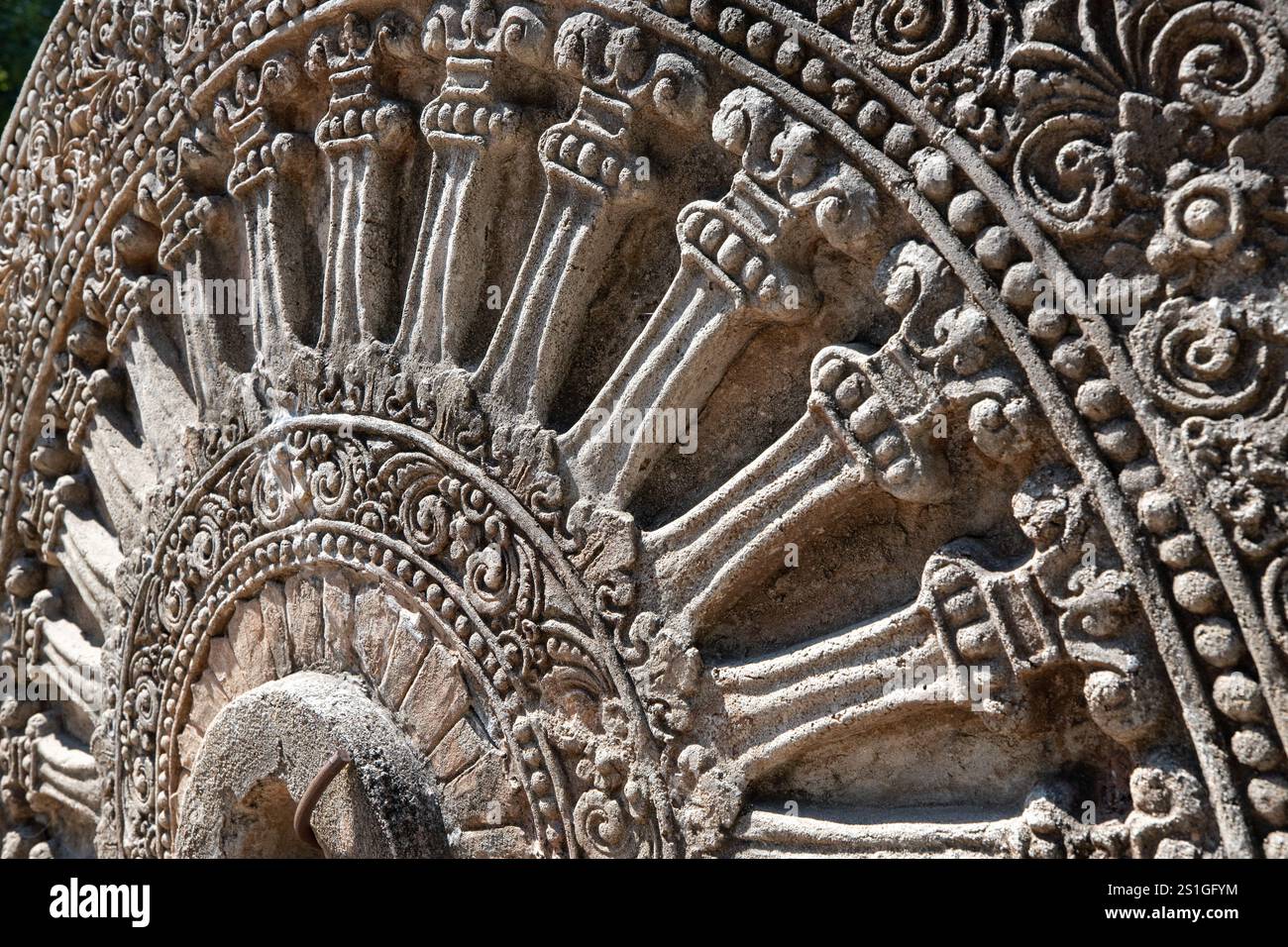 An ancient dharmachakra or wheel of dharma at Si Thep Historical Park ...