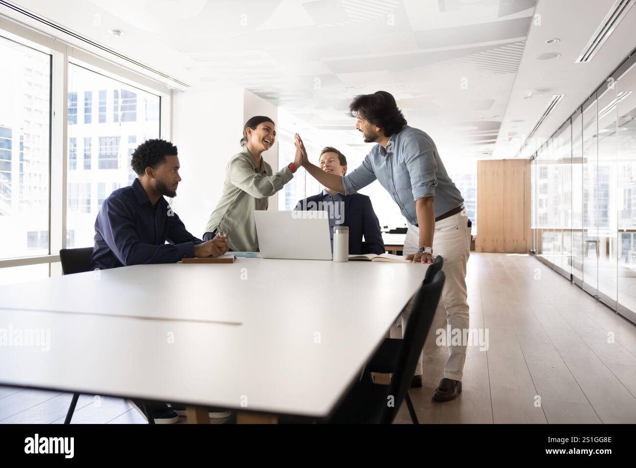 Happy Indian office colleagues clapping hands, giving high five Stock ...