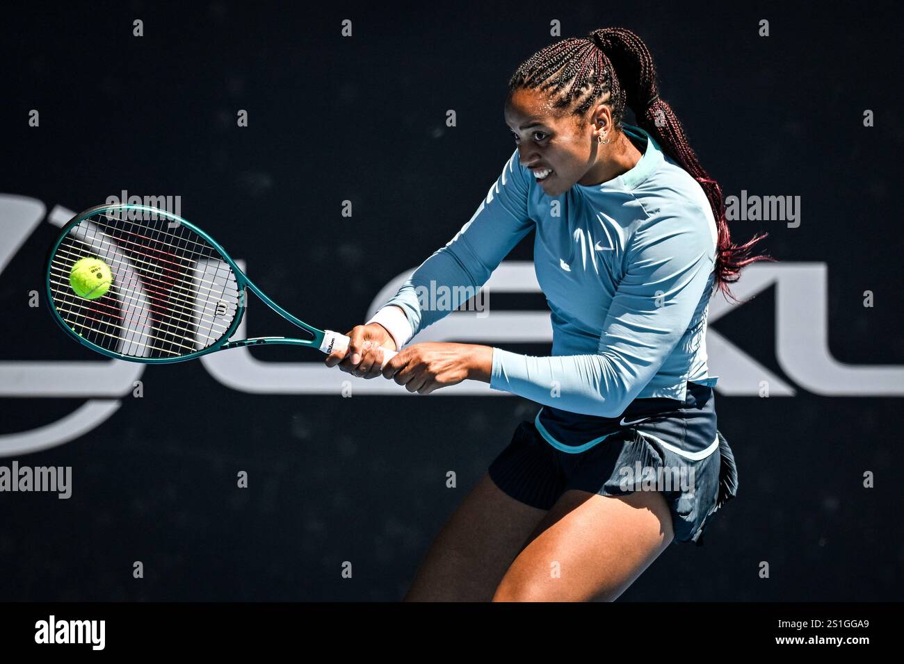 Robin Montgomery of the U.S., plays a shot against Clara Tauson of ...