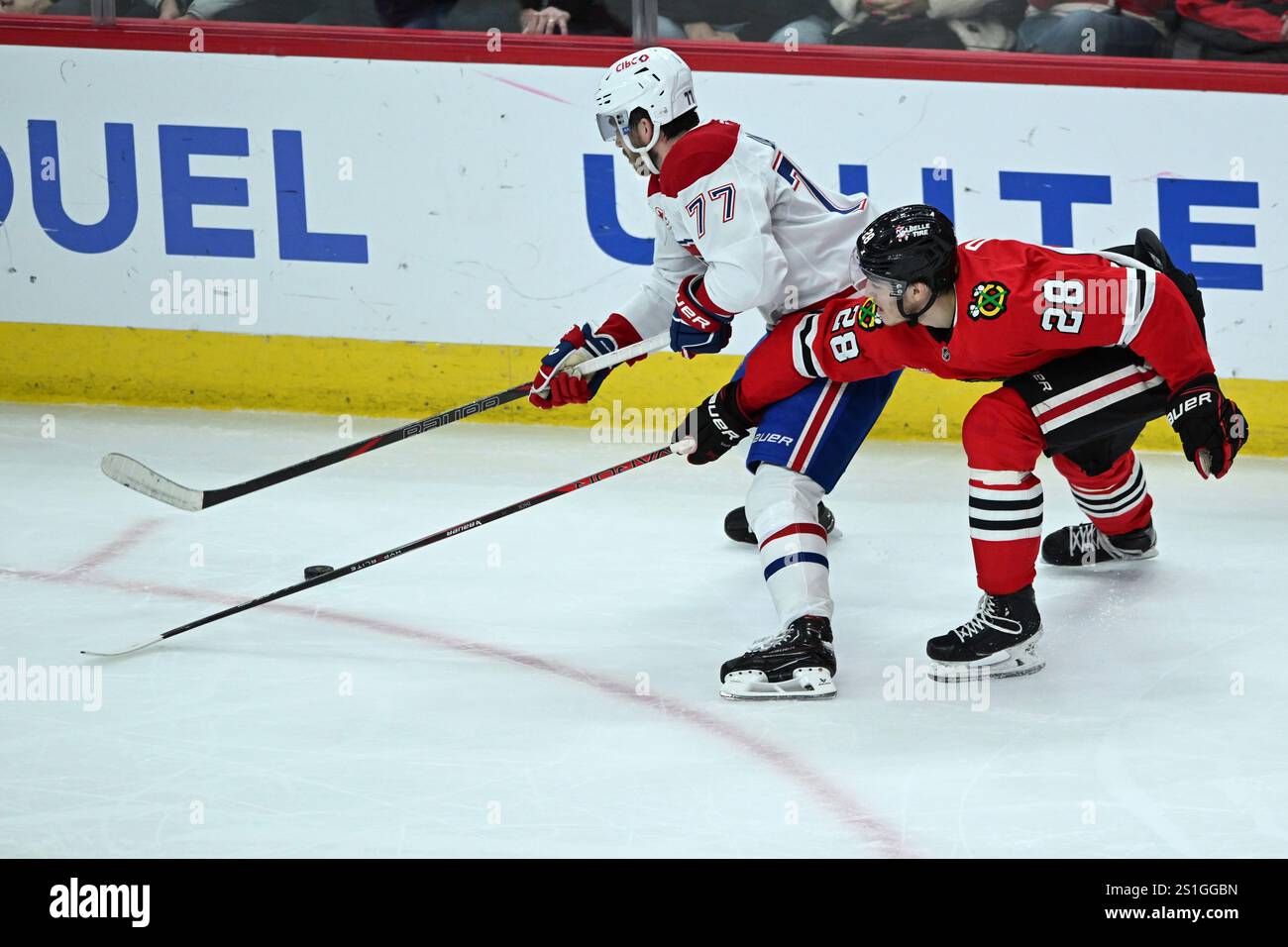Chicago Blackhawks' Colton Dach (28) battles Montreal Canadiens Kirby ...