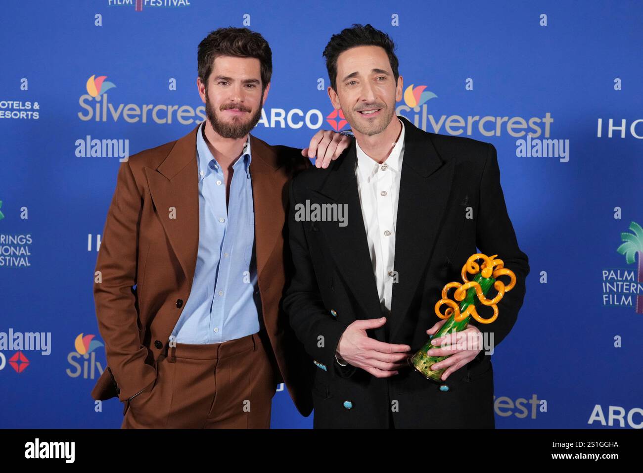Andrew Garfield, left, and Adrien Brody, winner of the desert palm ...