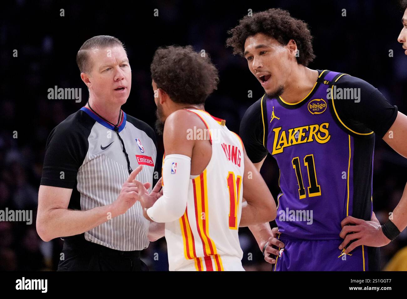 Los Angeles Lakers center Jaxson Hayes, right, jaws at Atlanta Hawks guard Trae Young, center ...