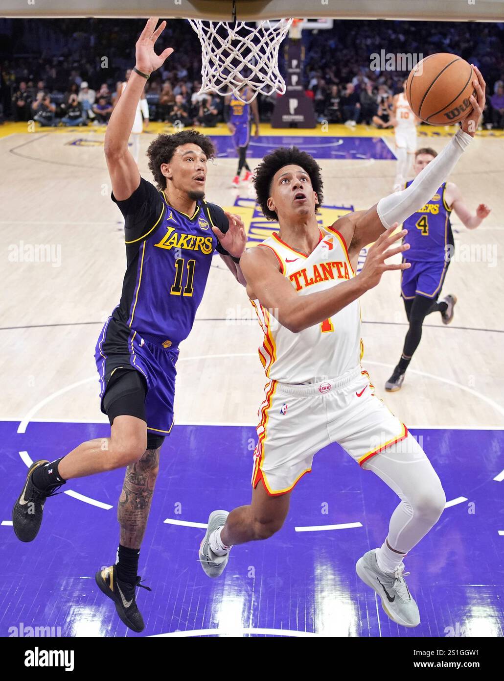 Atlanta Hawks forward Jalen Johnson, right, shoots as Los Angeles Lakers center Jaxson Hayes ...