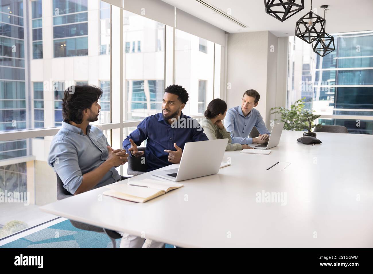 Diverse male project managers meeting in co-working space Stock Photo - Alamy