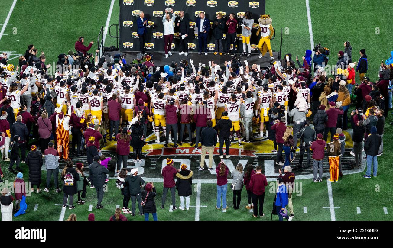Charlotte, NC, USA. 3rd Jan, 2025. Minnesota head coach PJ Fleck raises ...