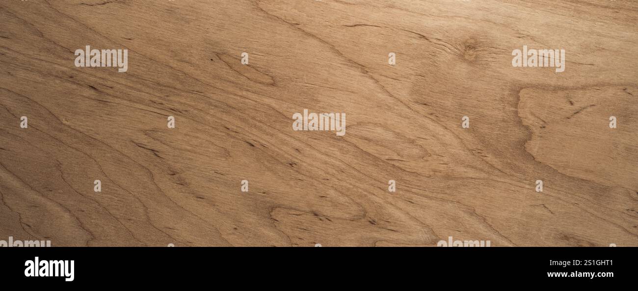 Textured wood surface displays natural patterns and warmth in a light ...