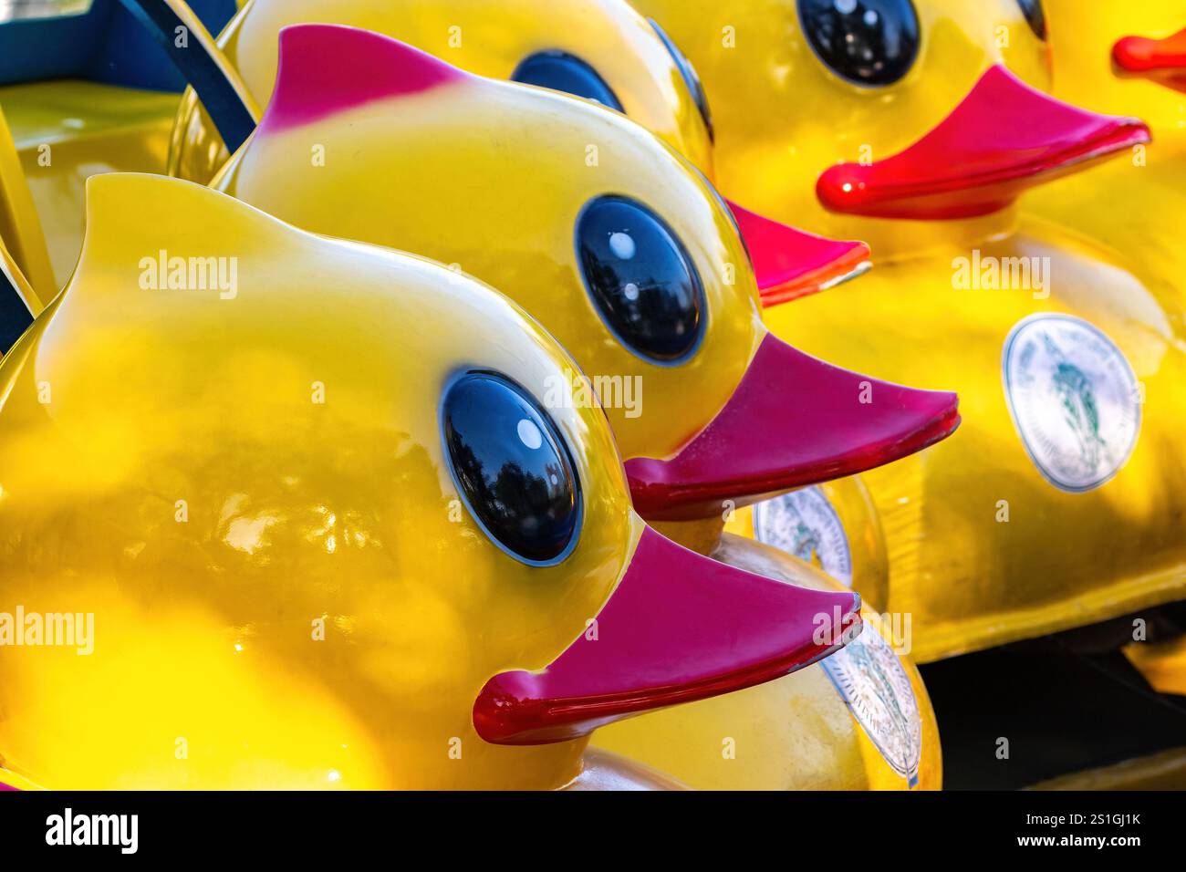 Paddle boats in the shape of yellow ducks. At the lake in Lumphini Park ...