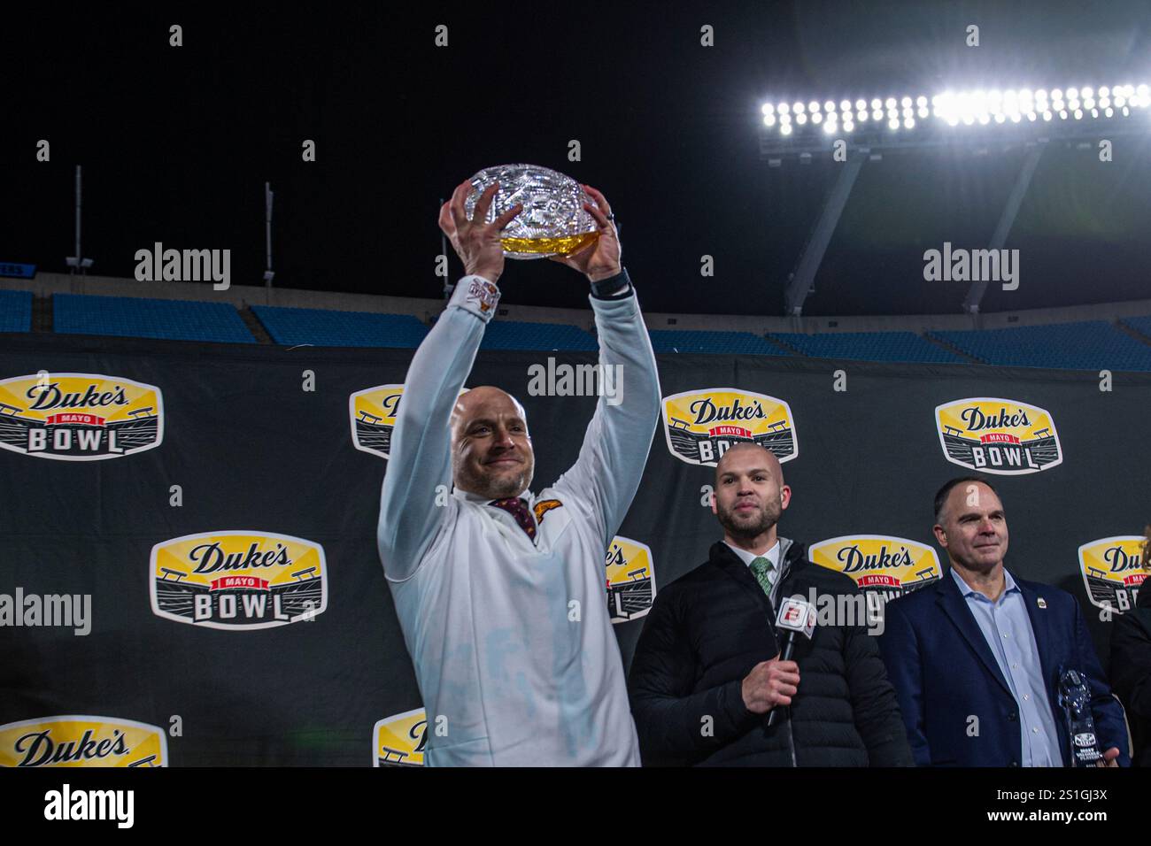 Minnesota head coach P.J. Fleck receives trophy after winning the Duke ...