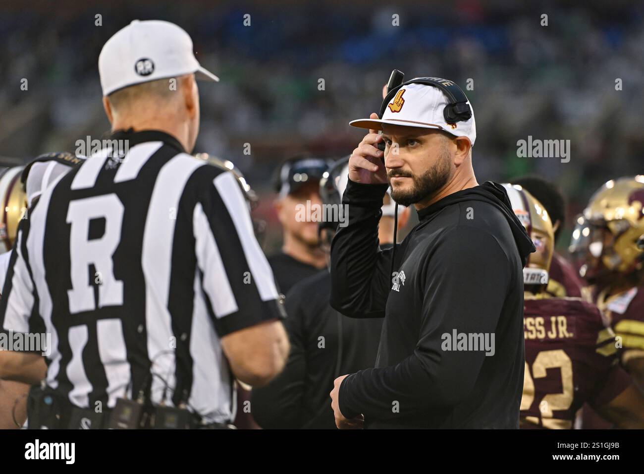 DALLAS, TX - January 03: Texas State Bobcats coach GJ Kinne talks to a ...