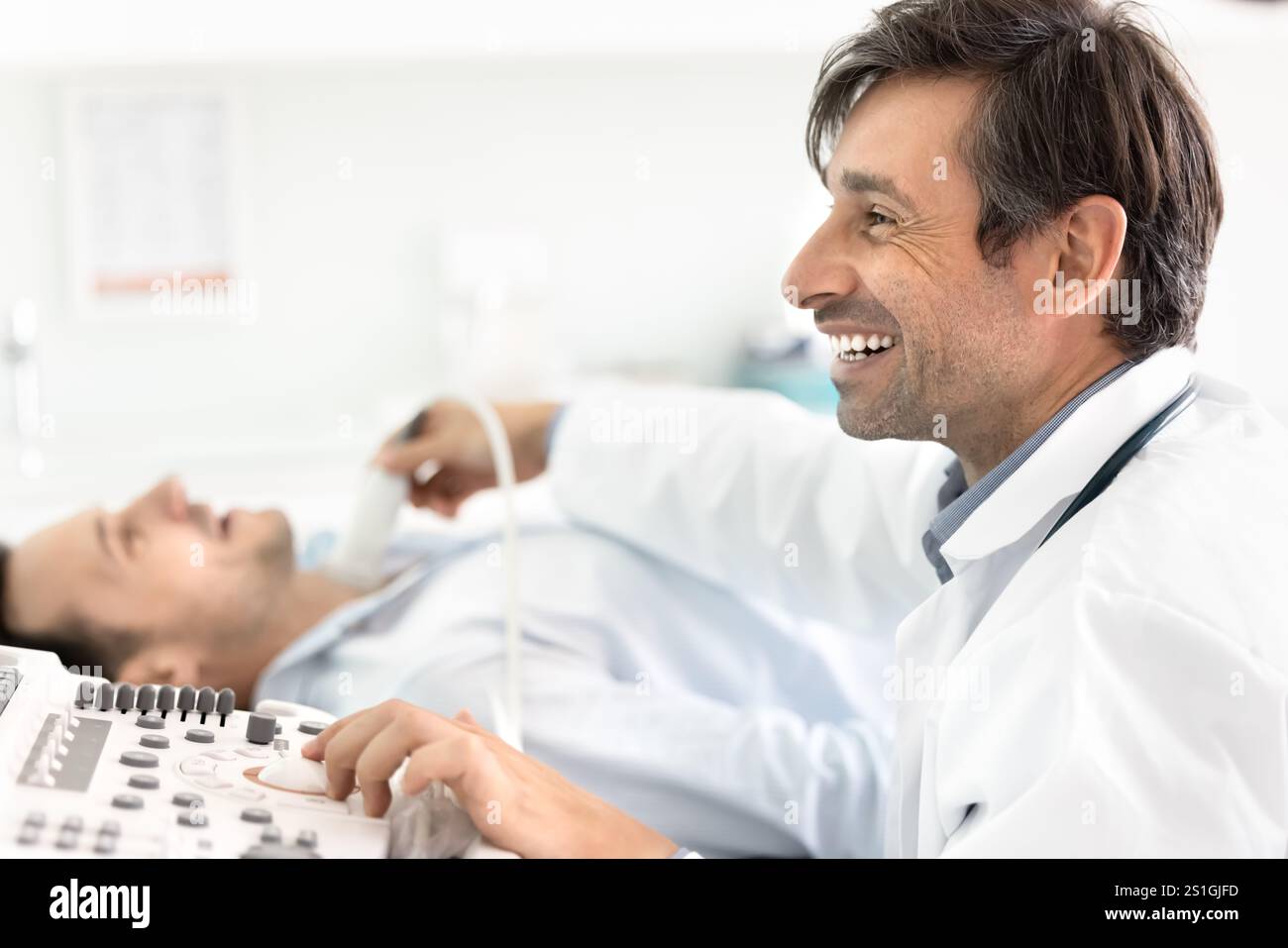 Happy endocrinologist doctor examining patients thyroid for nodes Stock ...
