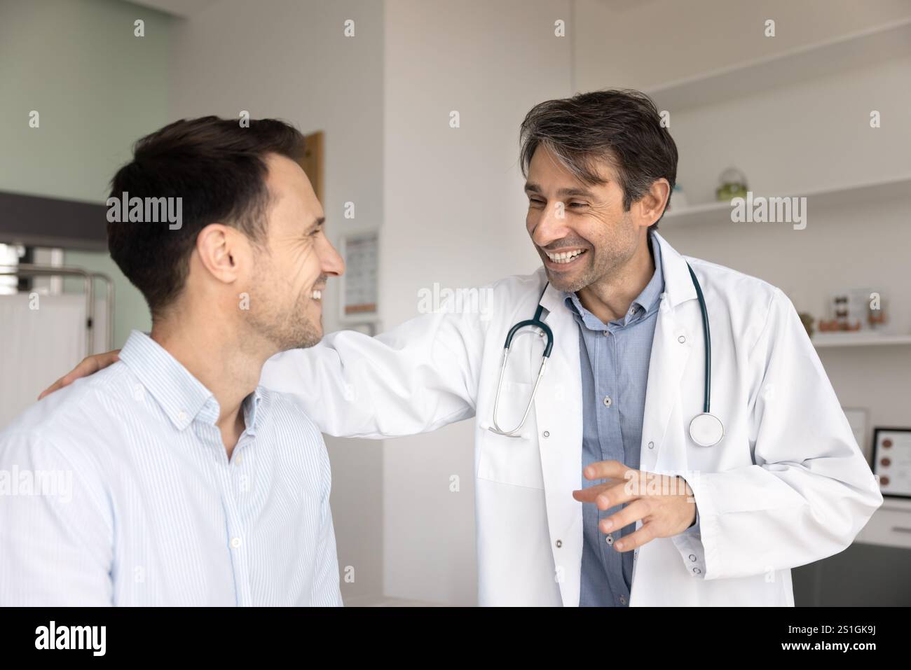 Happy cheerful Latin medical specialist expressing support to positive ...