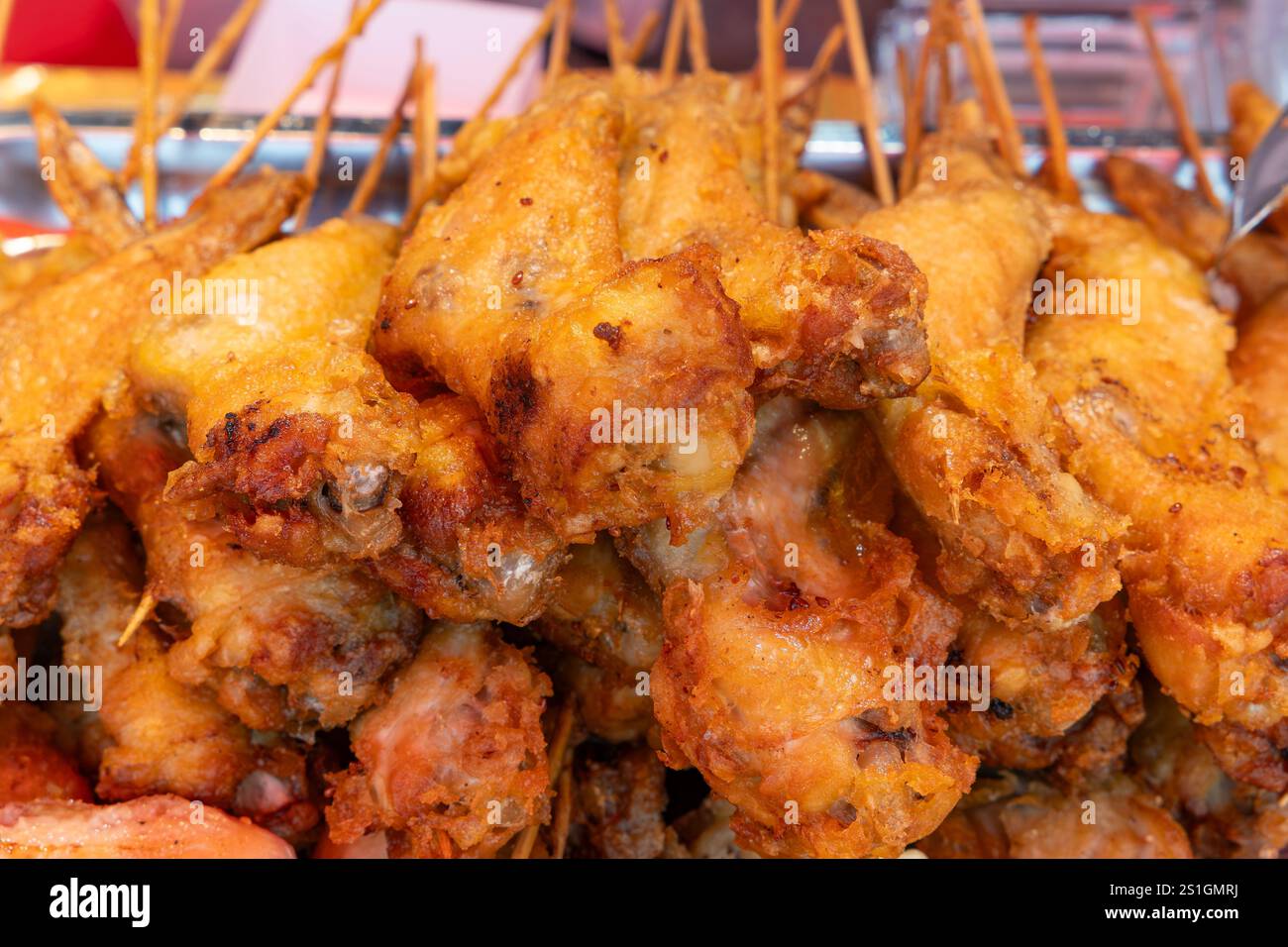 deep fried chicken wings at a street stall Stock Photo - Alamy