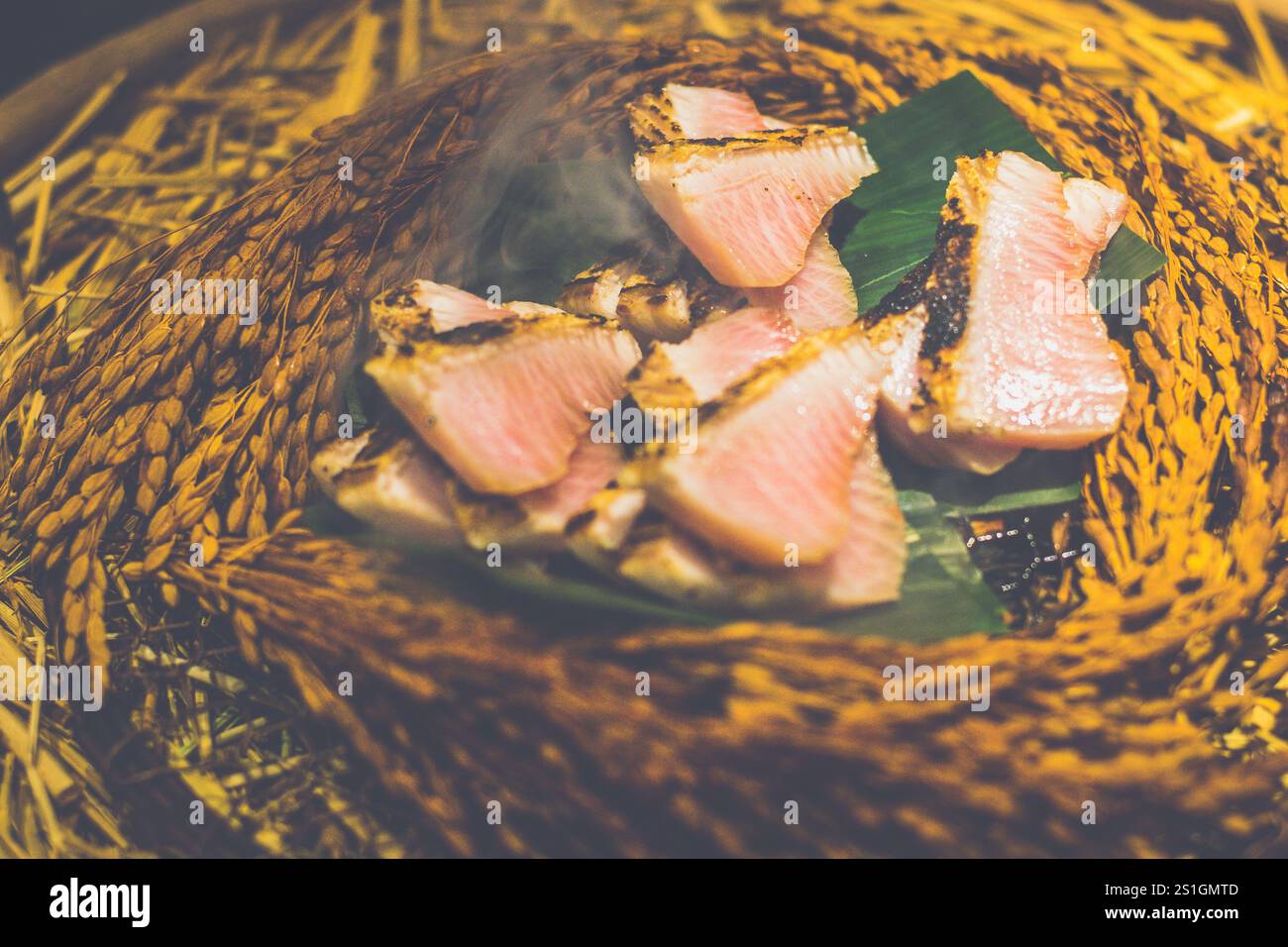 japanese winter Amberjack yellowtail fish smoked in Japanese rice straw ...