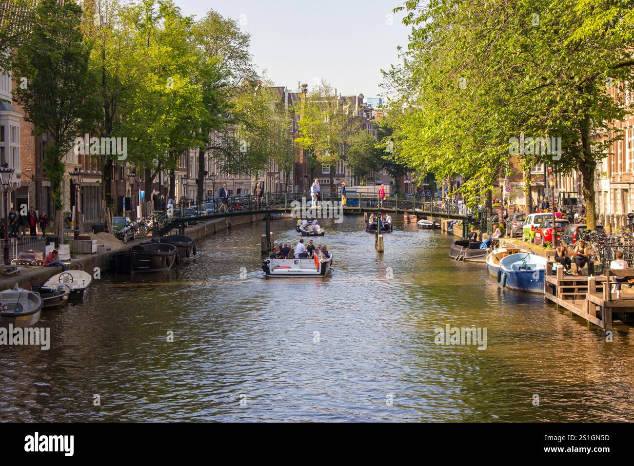 Canal with bridge and boats in Amsterdam, Netherlands. Traditional ...