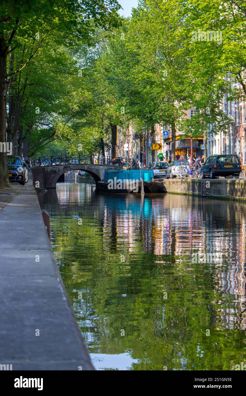 Canal with bridge and boats in Amsterdam, Netherlands. Traditional ...