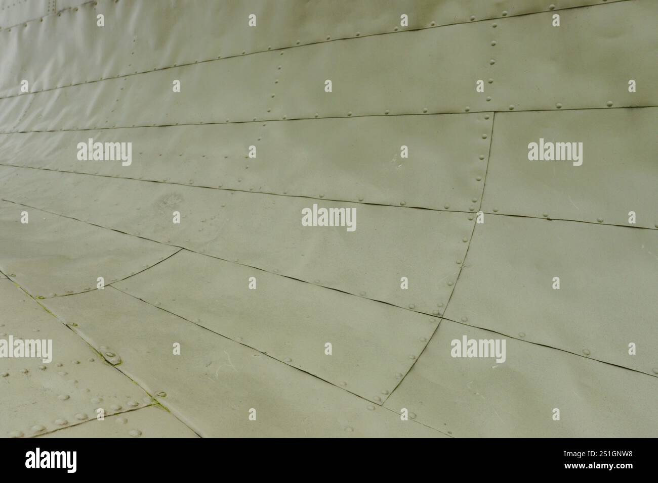 Airplane fuselage cladding surface is green. The surface of the ...