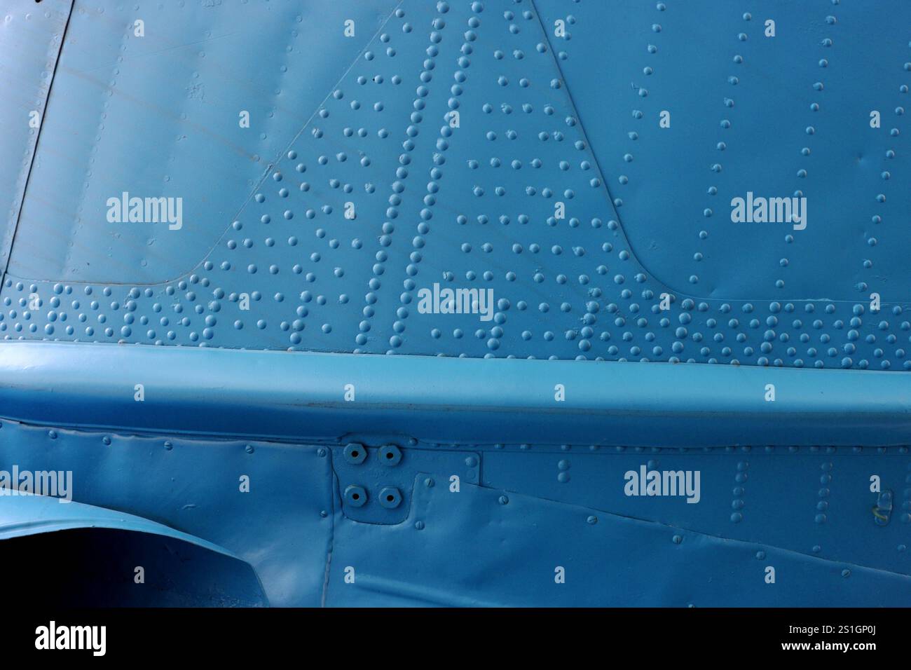 Fragment of a blue airplane fuselage...The side of a military airplane ...