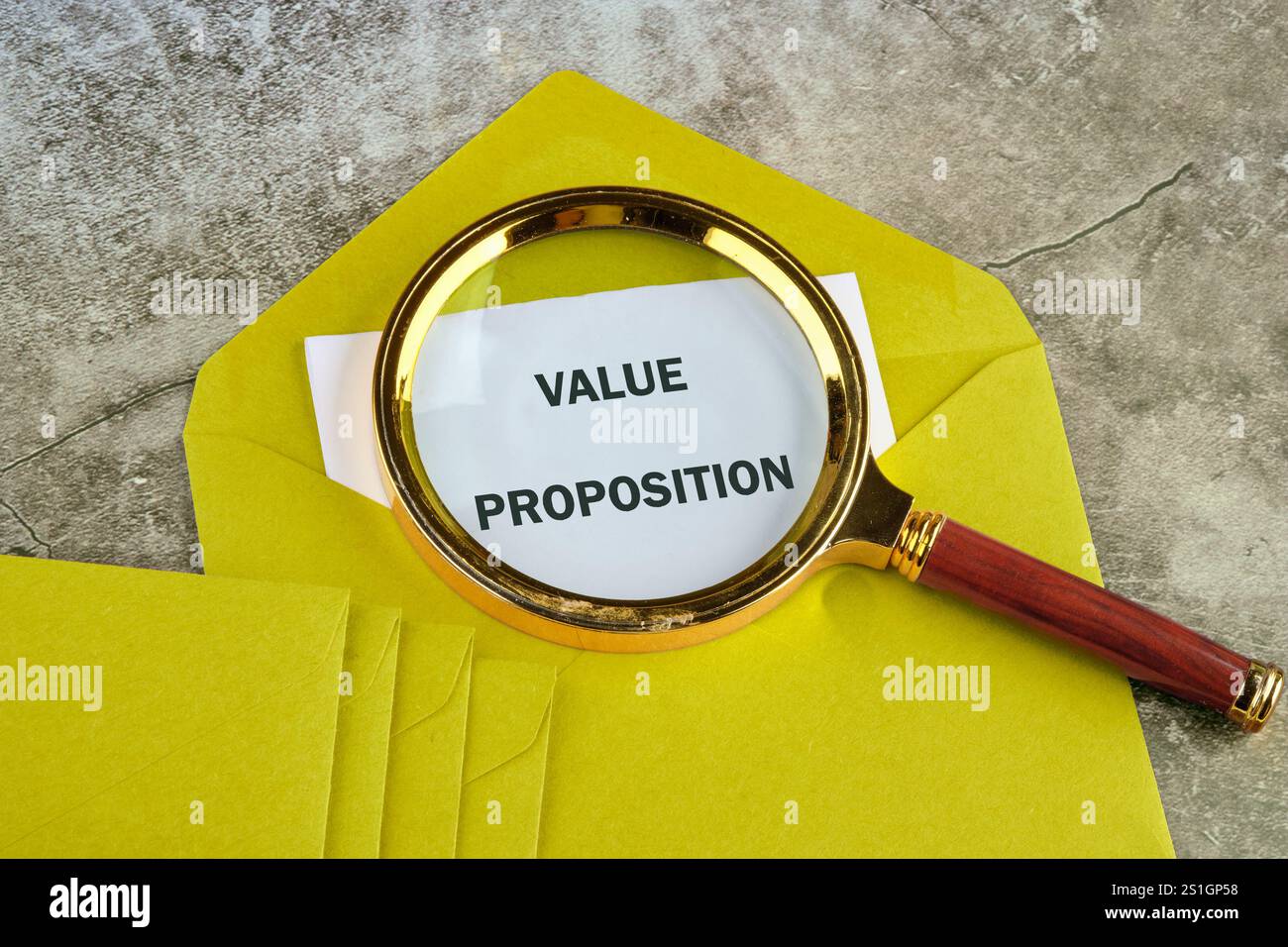Value added concept. Words VALUE PROPOSITION on paper sticking out of a ...