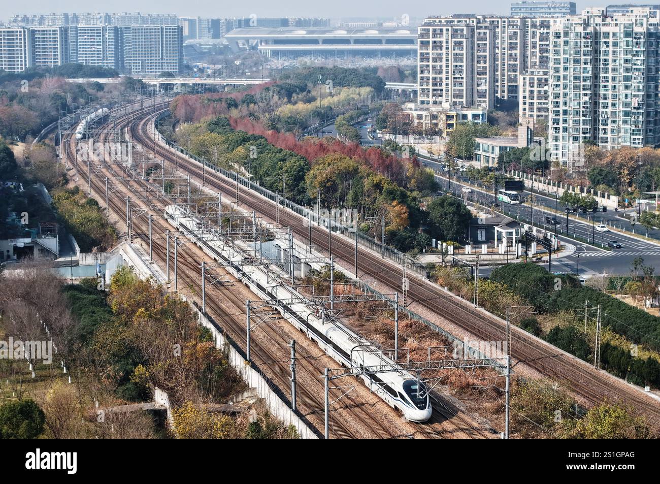 A high-speed train runs on a high-speed rail line in the main urban ...