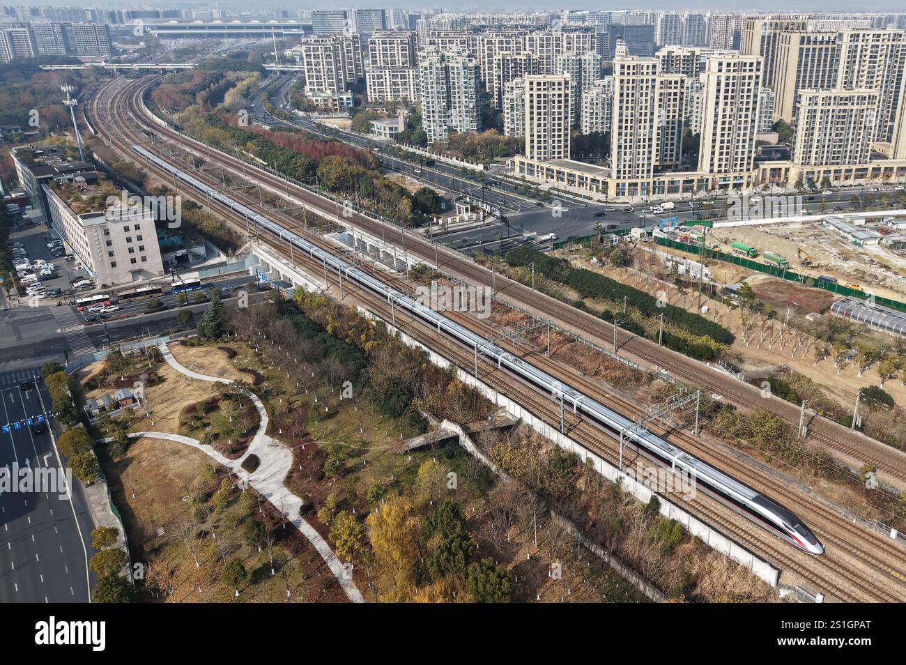 A high-speed train runs on a high-speed rail line in the main urban ...