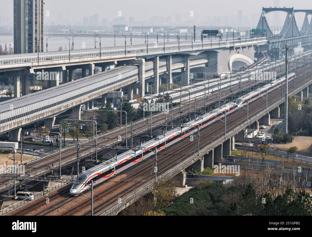 A high-speed train runs on a high-speed rail line in the main urban ...