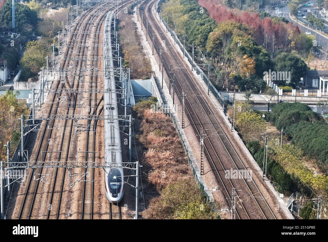 A high-speed train runs on a high-speed rail line in the main urban ...